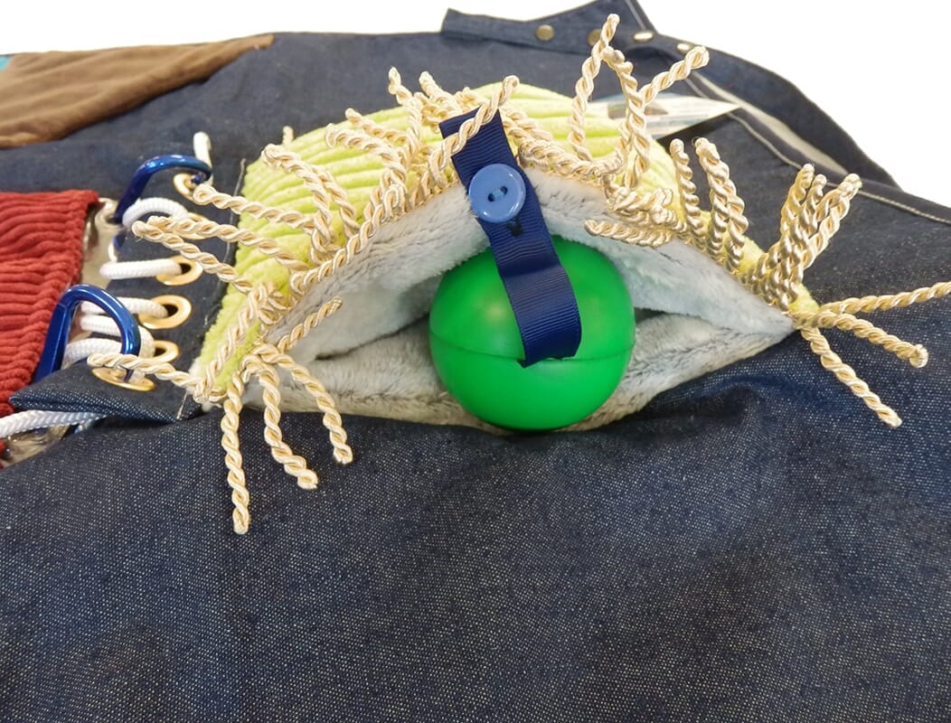 Fiddle Muff Sensory Apron from Essential Aids